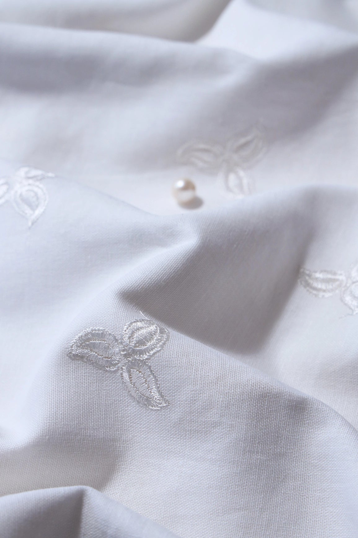 White Thread Small Floral Embroidery Work On White Organic Cotton Fabr